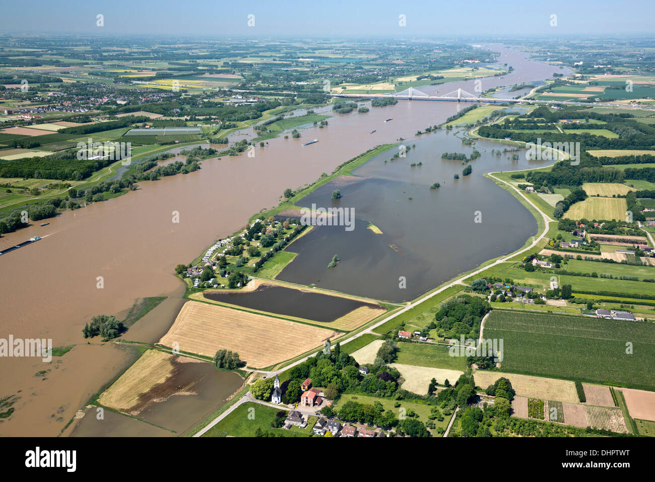 Netherlands, Slijk-Ewijk. Waal river. Flooded land and floodplains ...