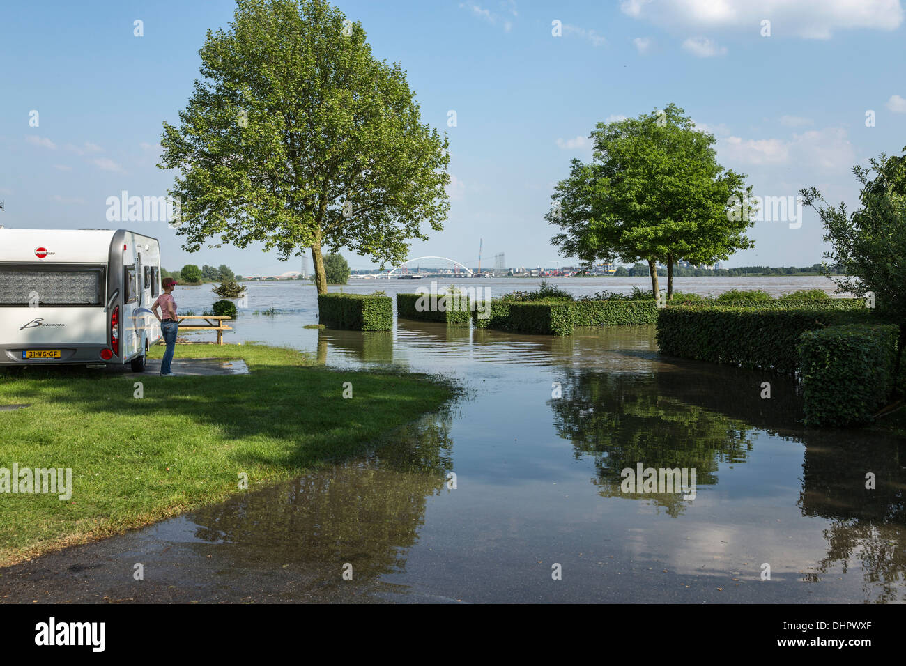 Netherlands, Slijk-Ewijk, Caravan on camping site in the flood plains ...