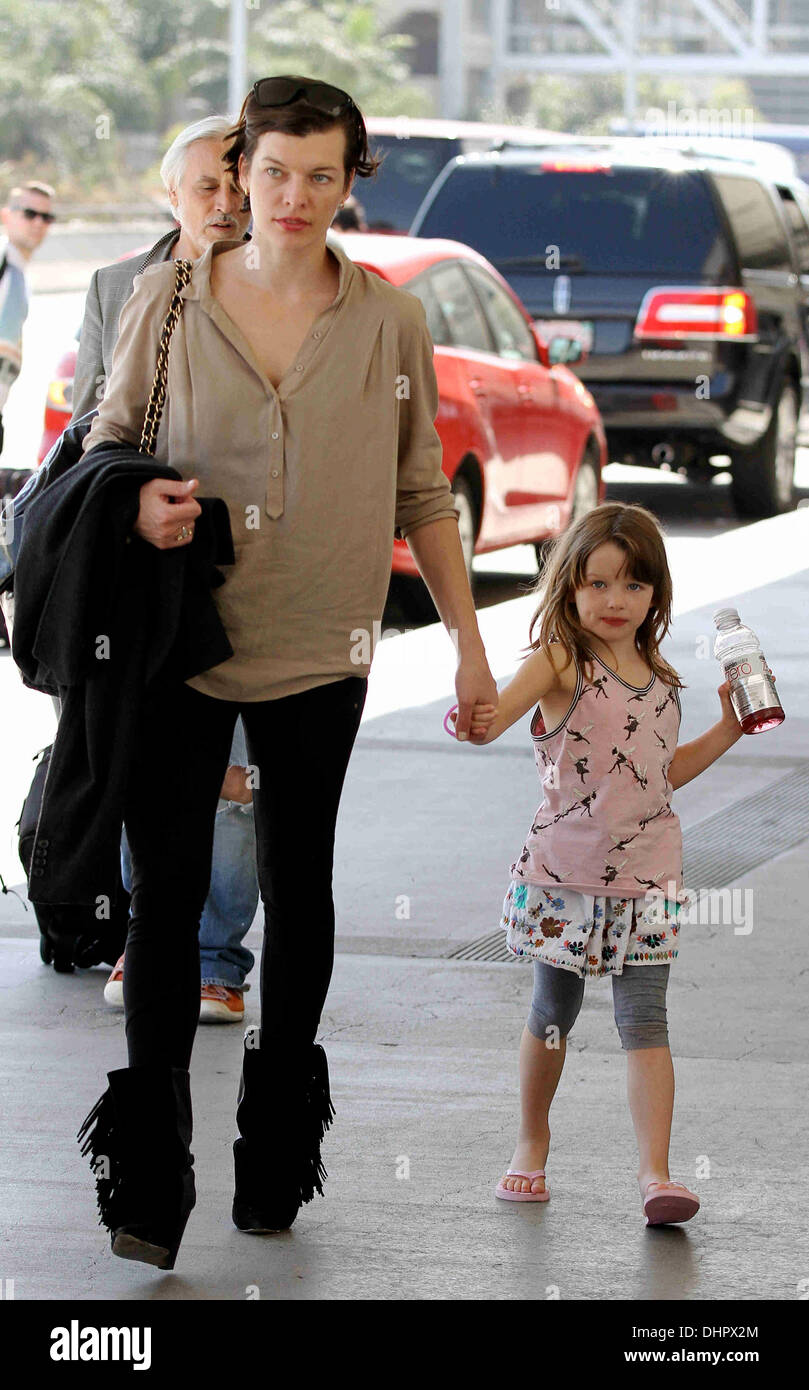 Milla Jovovich and her daughter Ever Gabo Anderson arriving at LAX ...