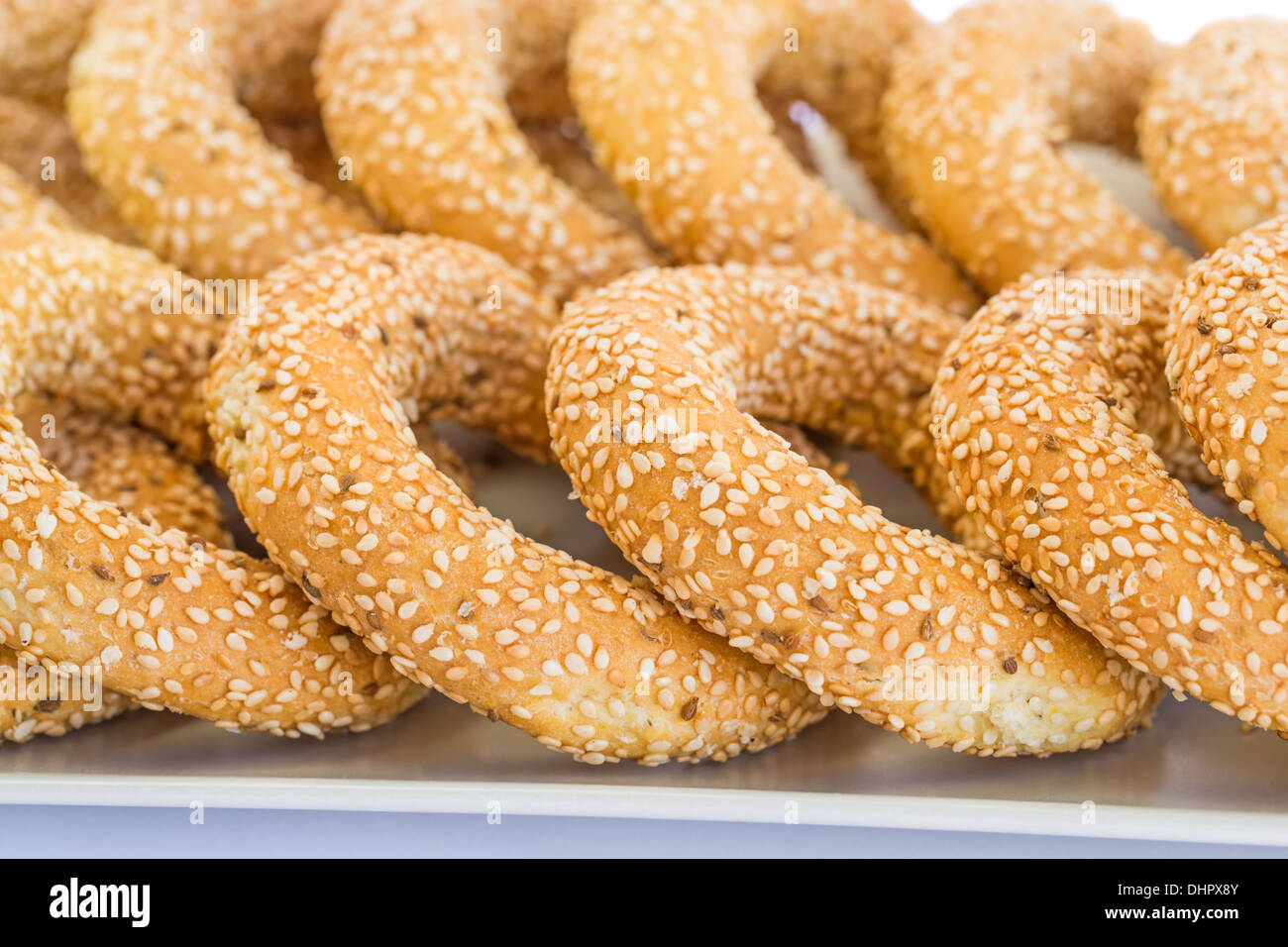 Round rusks with sesame seeds on tray Stock Photo - Alamy