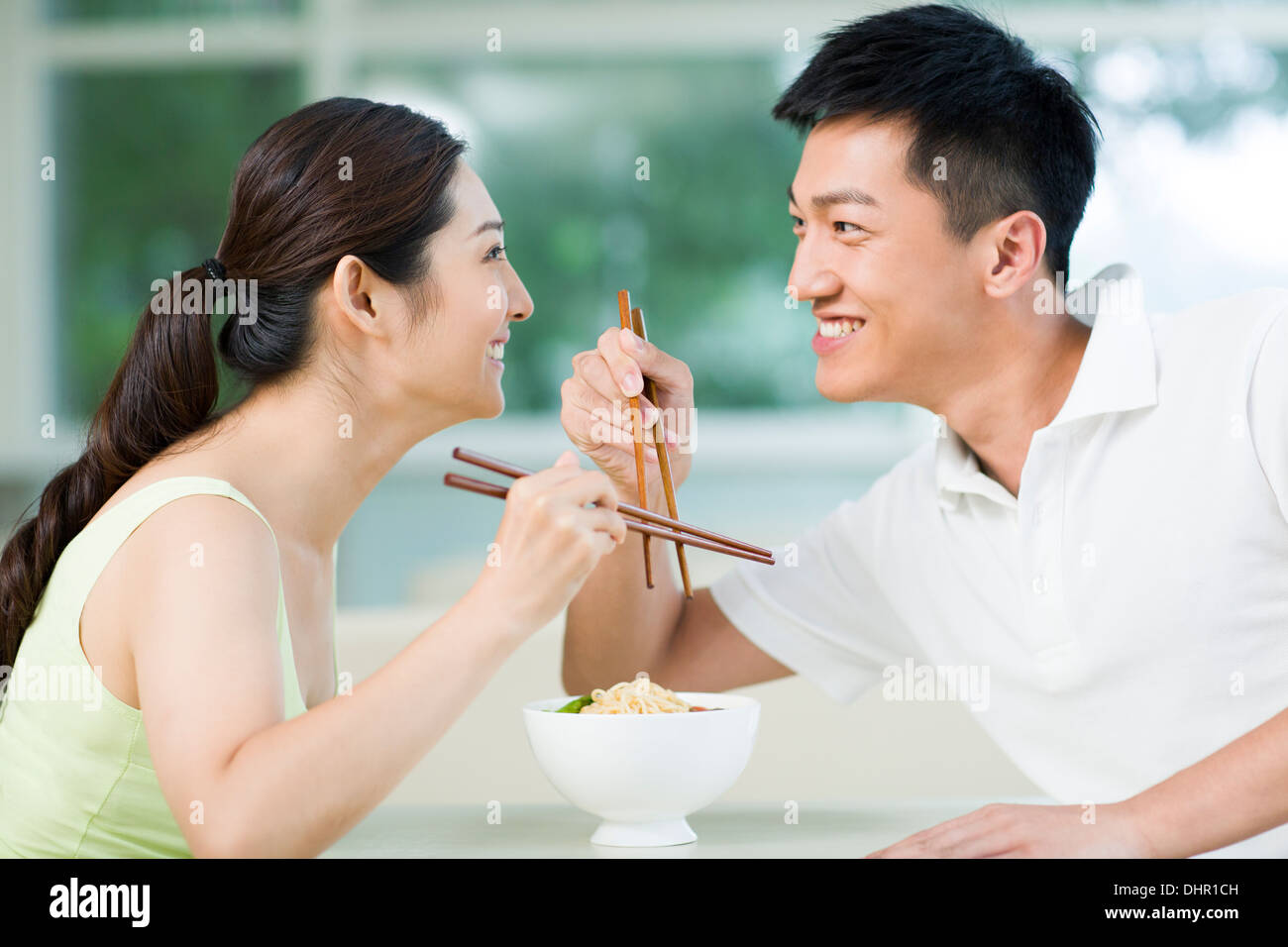 Asian couple eating noodles hi-res stock photography and images - Alamy