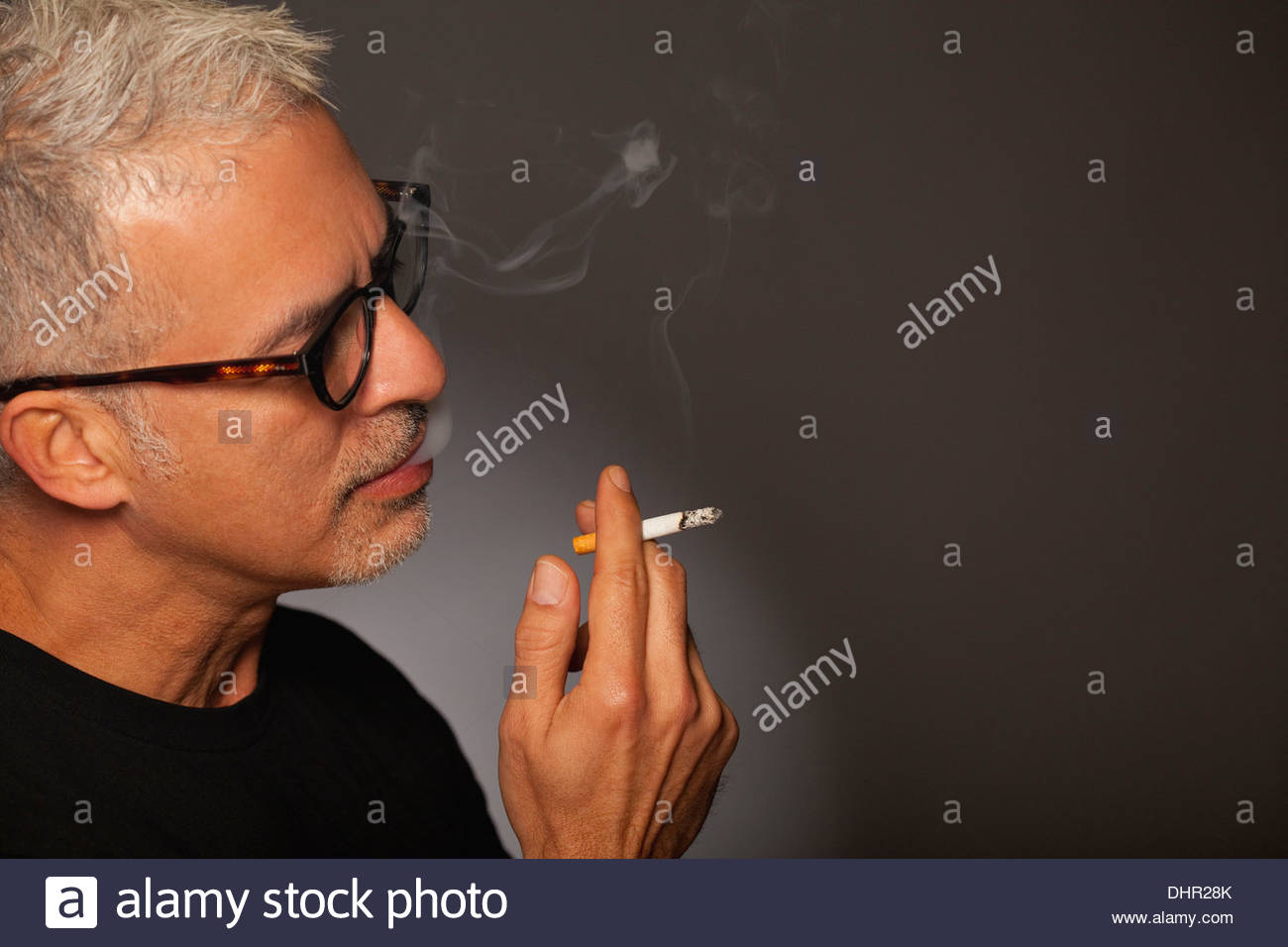 Handsome Man Smoking Cigarette Stock Photos & Handsome Man Smoking ...