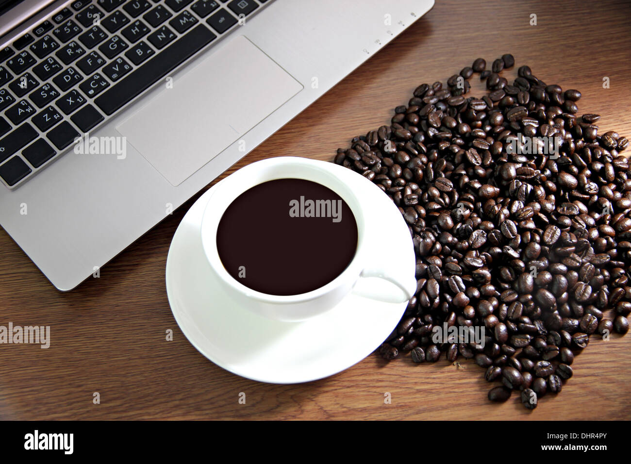 Picture of high view Coffee in white cup and see the Computers,Coffee ...