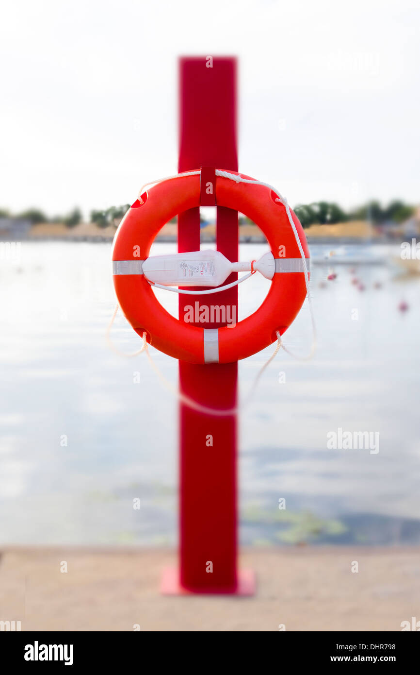 Life ring, lifesaver hanging on post Stock Photo - Alamy