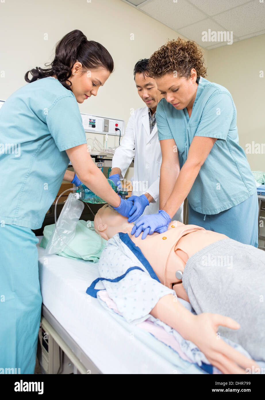 Medical Team Performing CPR On Dummy Stock Photo - Alamy