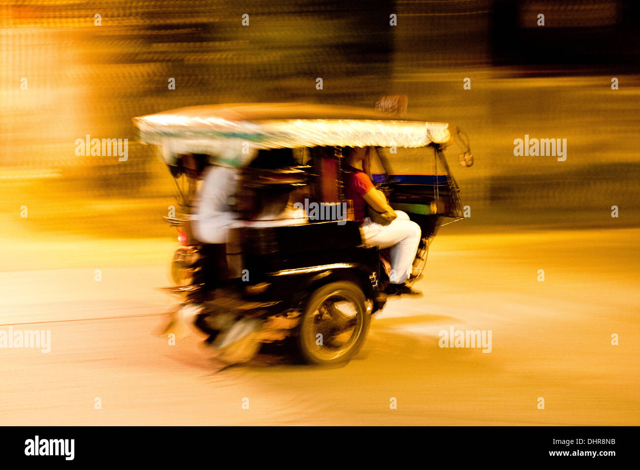 A tuk tuk speeds down the road in Davao Stock Photo - Alamy