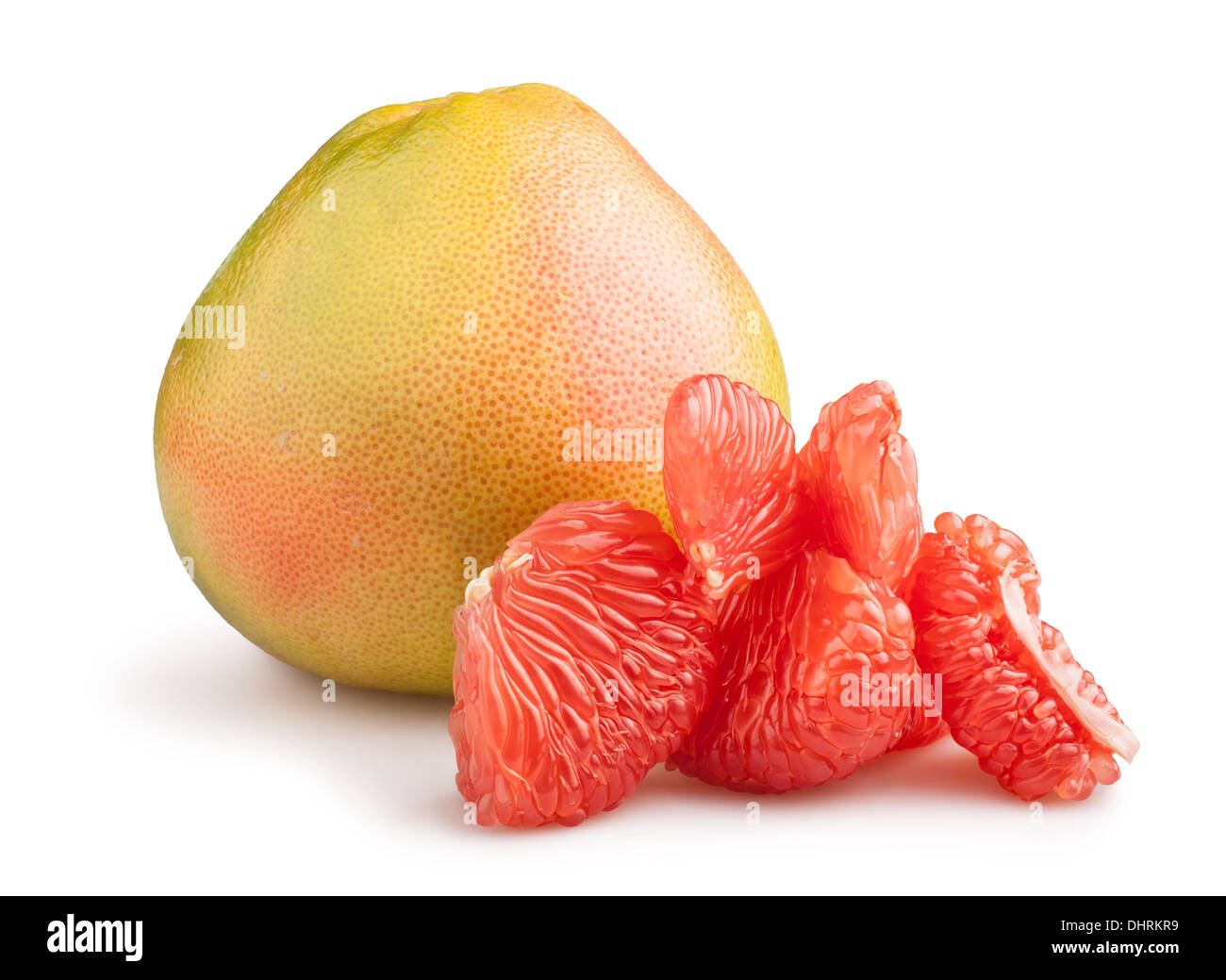 pomelo cut isolated on white Stock Photo - Alamy