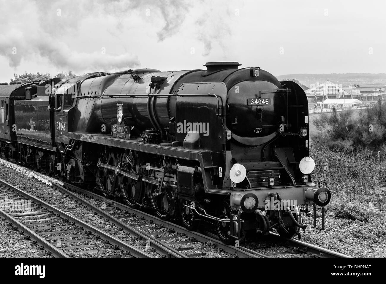 Steam locomotive 34046 Braunton leaves Dawlish Warren station with The ...
