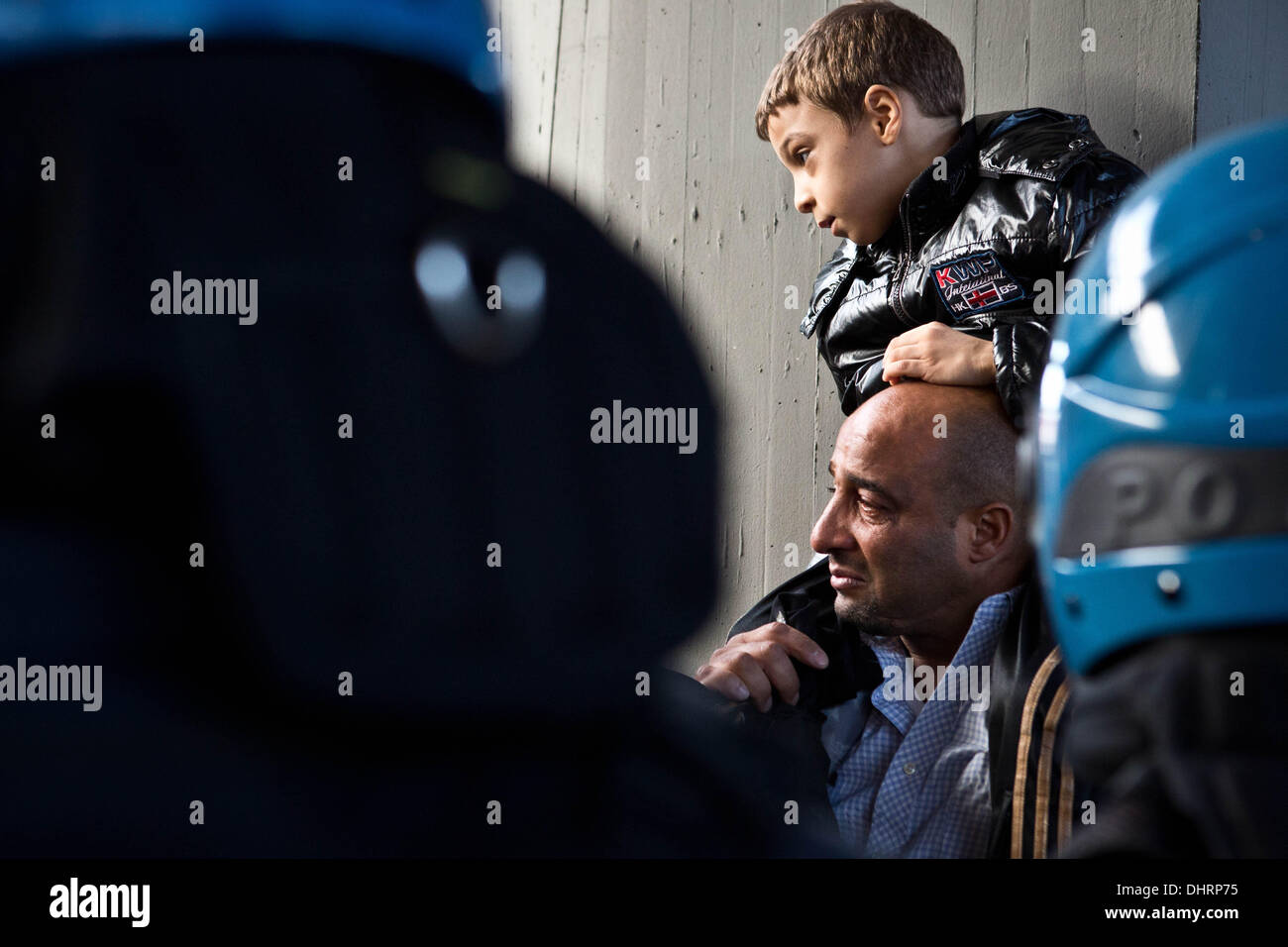 Rome, Italy. 14th Nov, 2013. A protester crying with his son on his ...