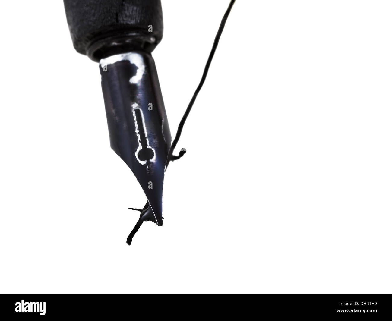 drawing pen with metal nib drafting straight line by black ink on white ...