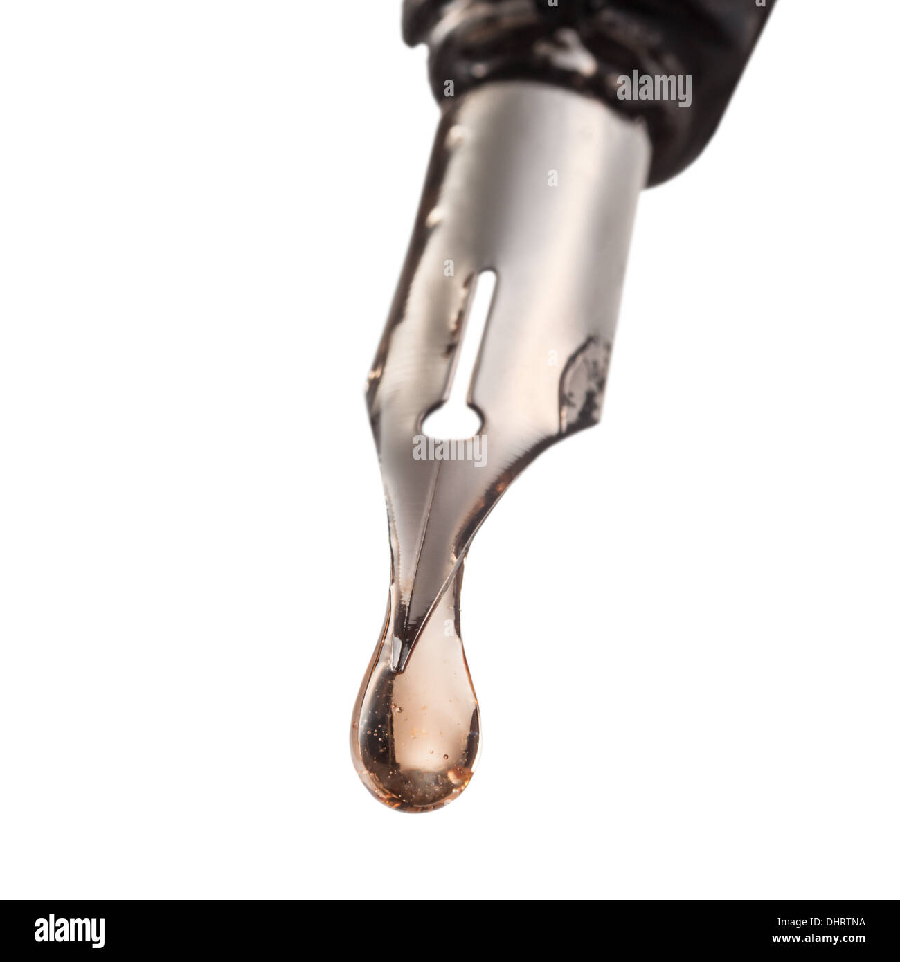 drop of transparent liquid on tip of pen close up isolated on white ...