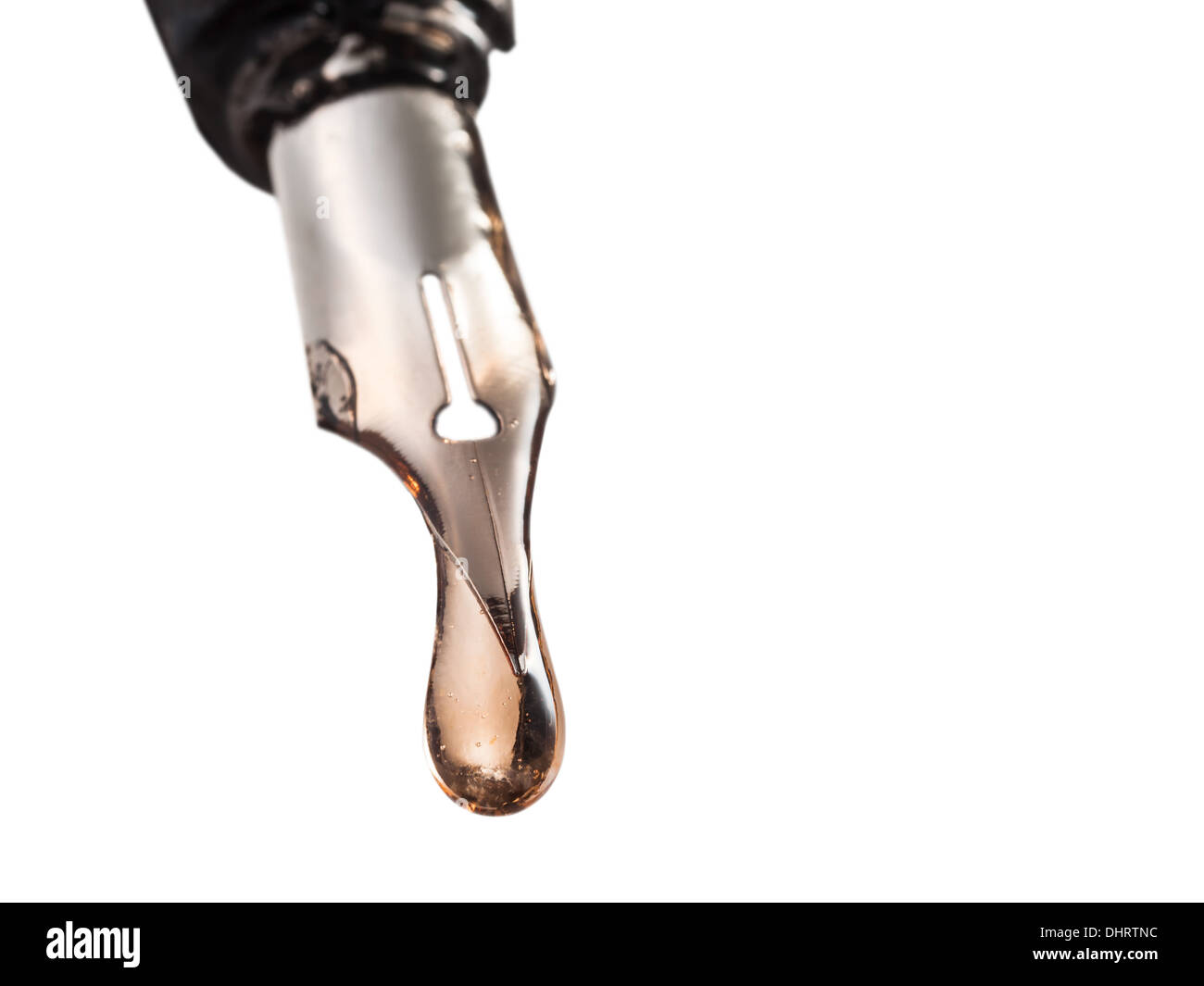 drop of transparent fluid on tip of pen close up isolated on white ...