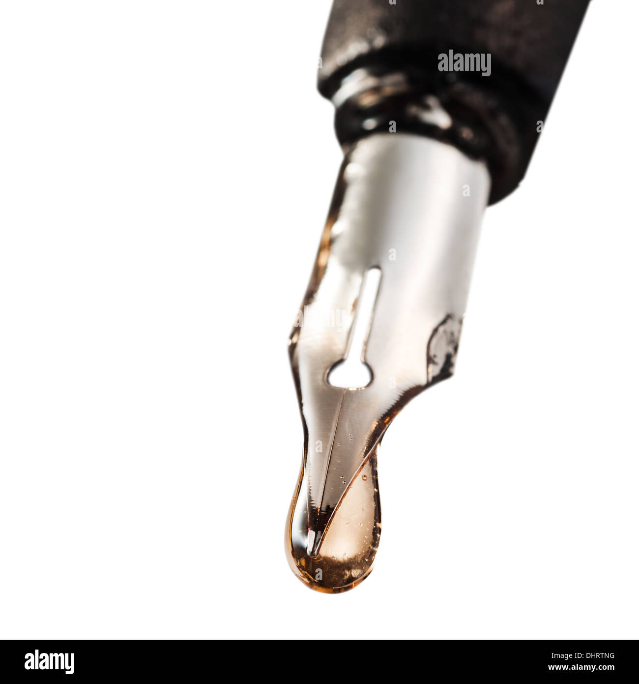 drop of transparent poison on tip of pen close up isolated on white ...