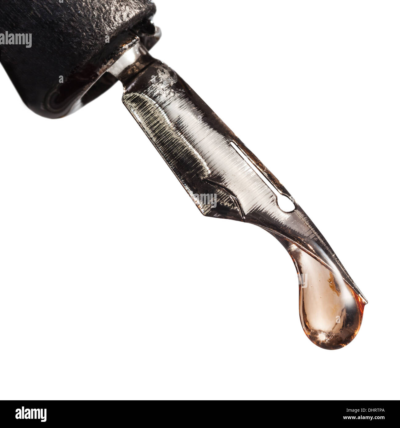 macro view of drop of transparent liquid on tip of pen isolated on ...