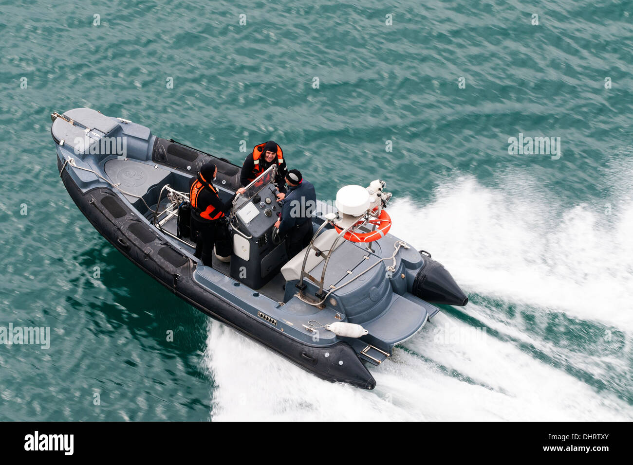 Scuba diving inflatable speedboat going / returning from a dive, three ...