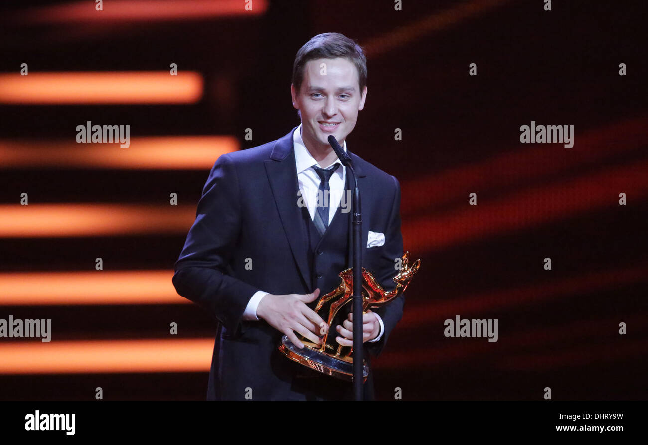 Berlin, Germany. 14th Nov, 2013. German actor Tom Schilling receives a ...
