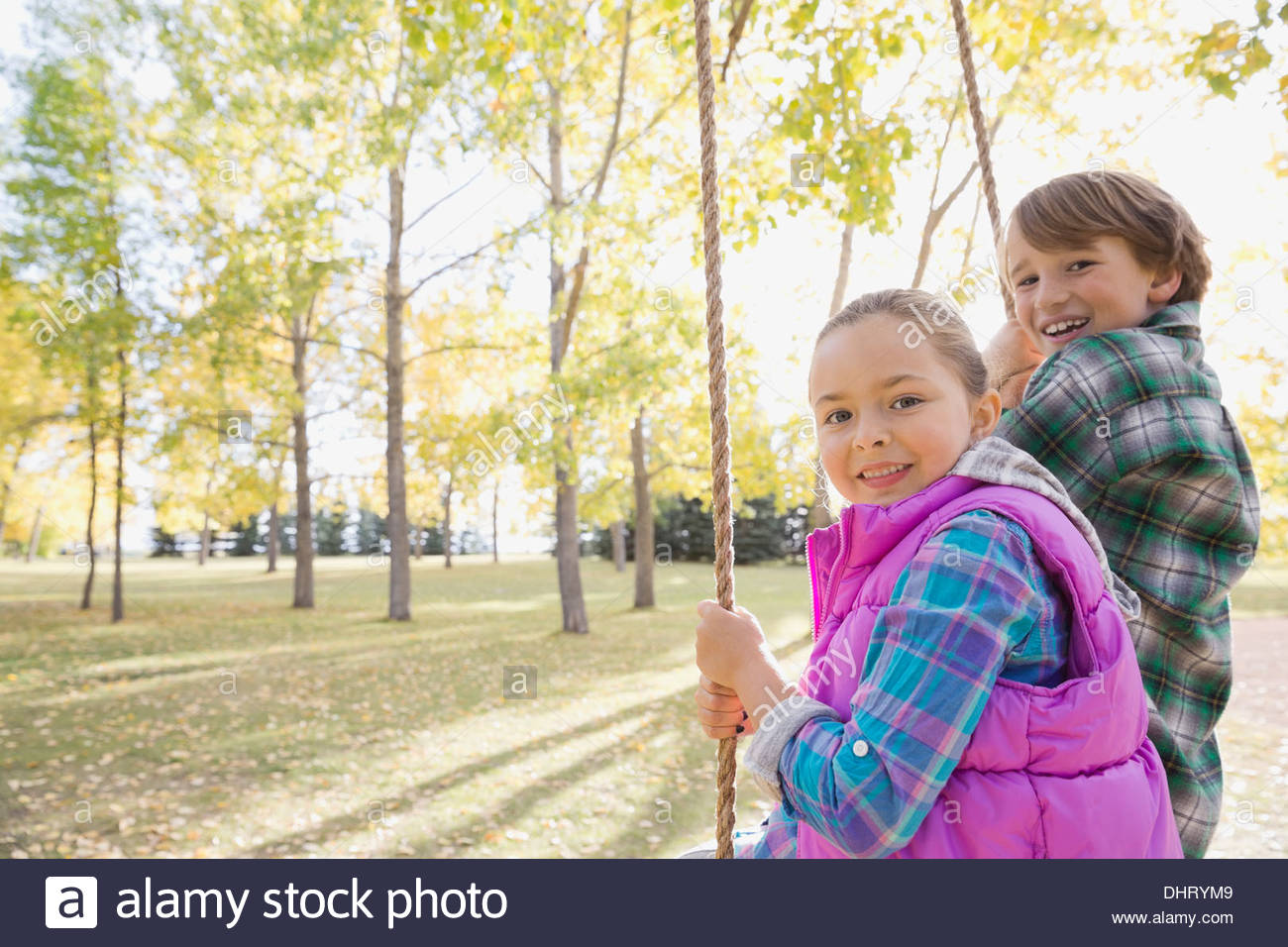 Children swinging hi-res stock photography and images - Alamy