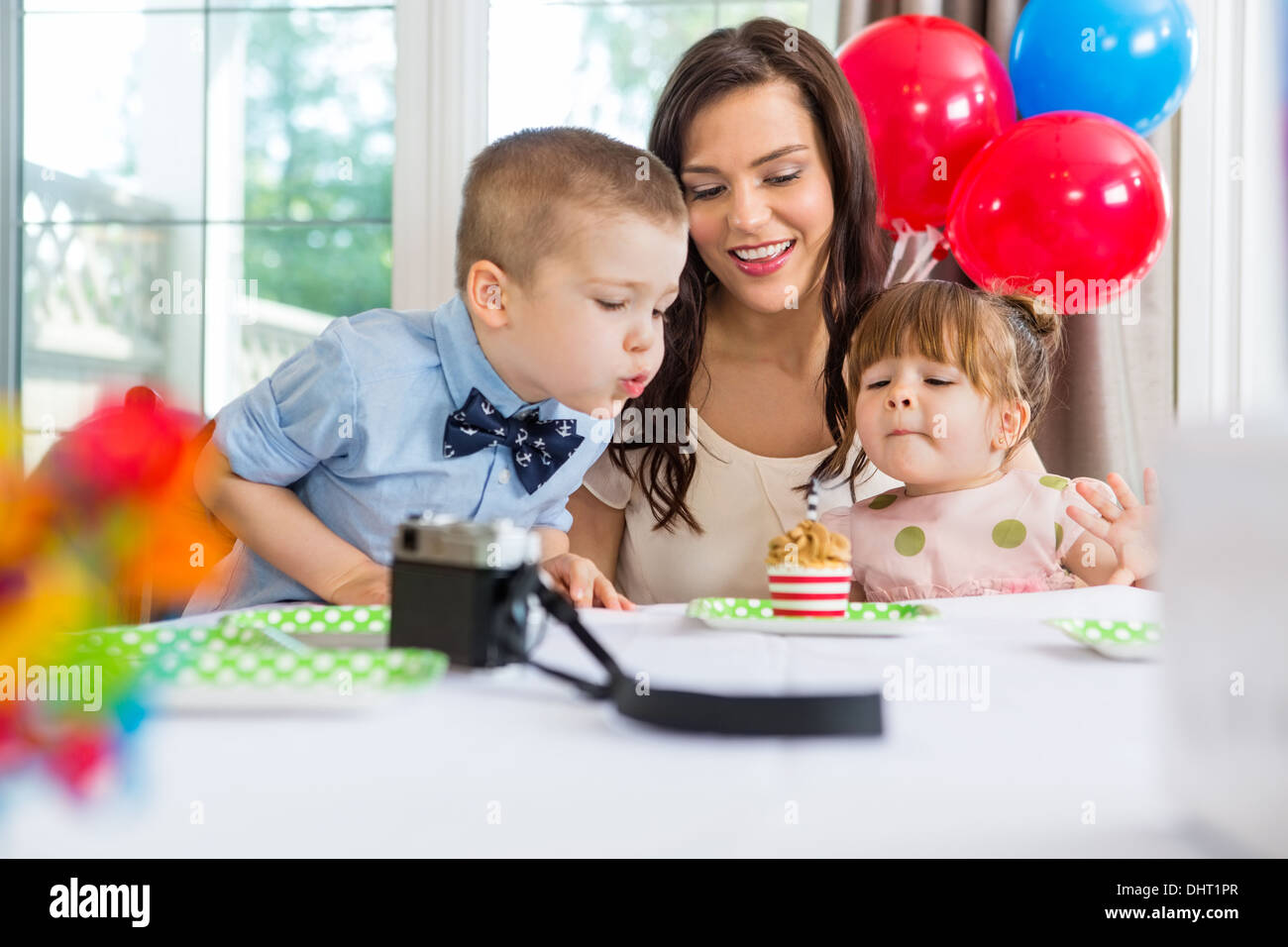 Family Celebrating Boy's Birthday Stock Photo - Alamy