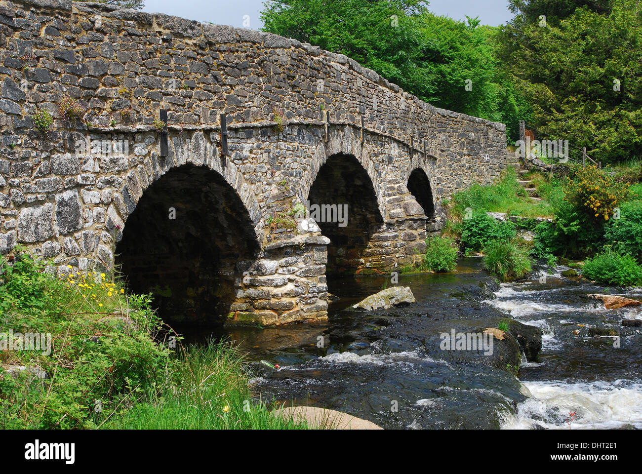 Historic stone road bridge in the town of Postbridge, Dartmoor National ...