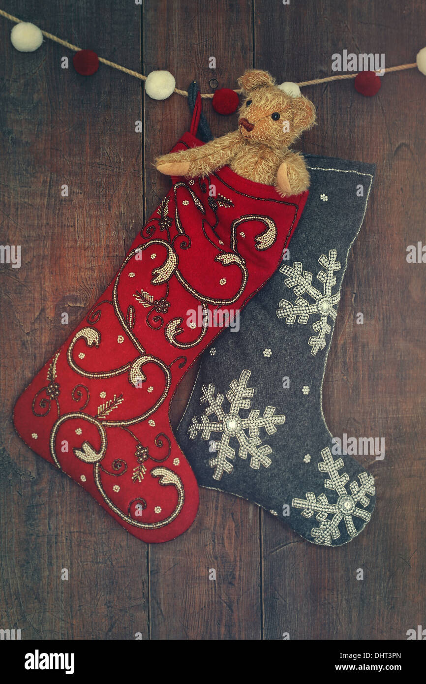 Small teddy bear in stocking for Christmas Stock Photo - Alamy
