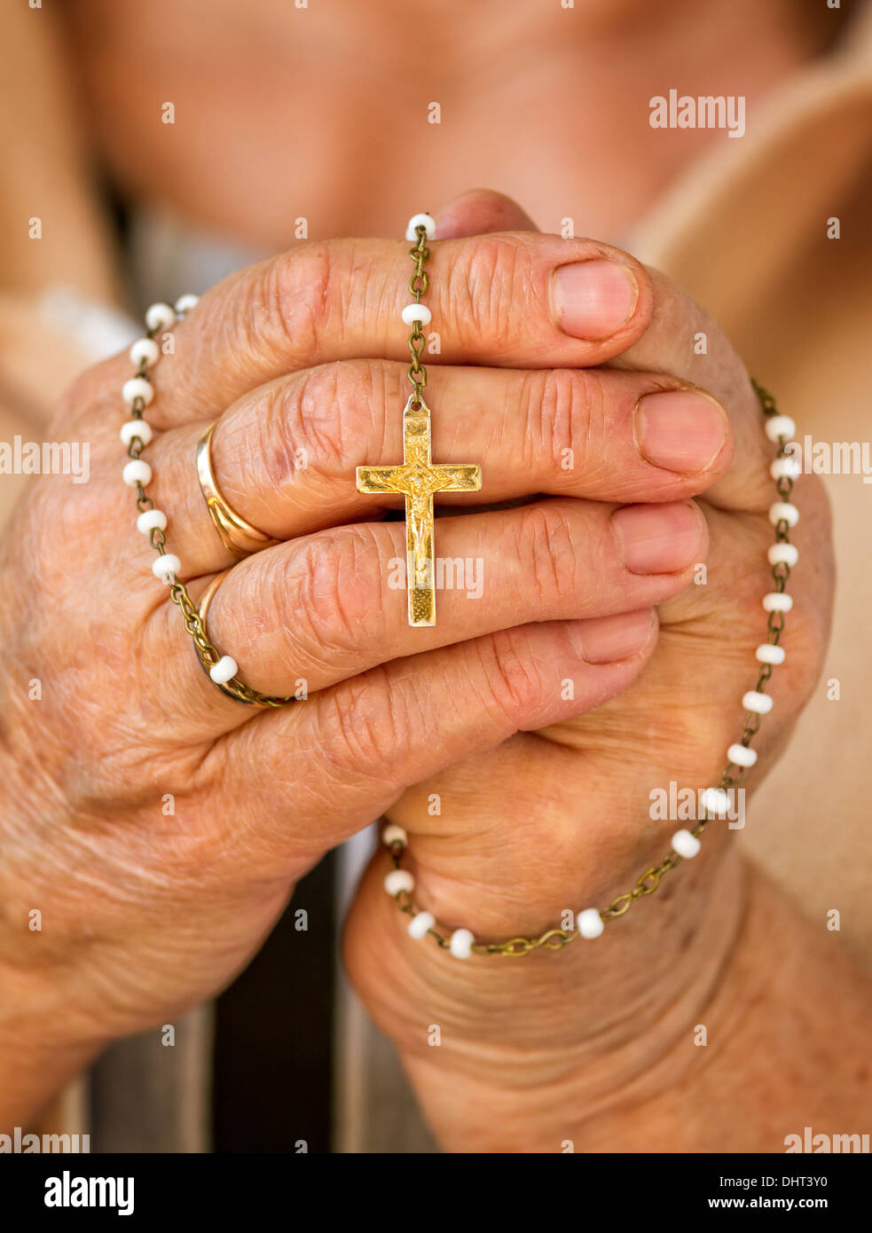 Praying with a rosary Stock Photo - Alamy