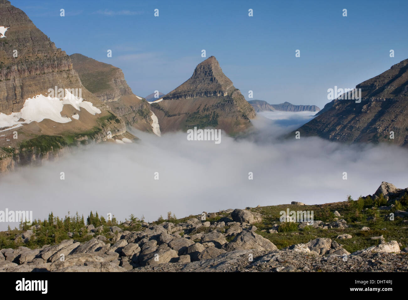 Wahcheechee Peak and valley fog from Sue Lake, Glacier National Park ...