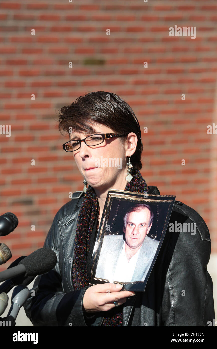 Boston, Massachusetts, USA. 14th Nov, 2013. Sandra Patient holds a ...
