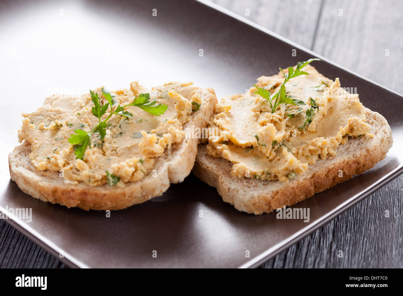 Toast with hummus Stock Photo - Alamy