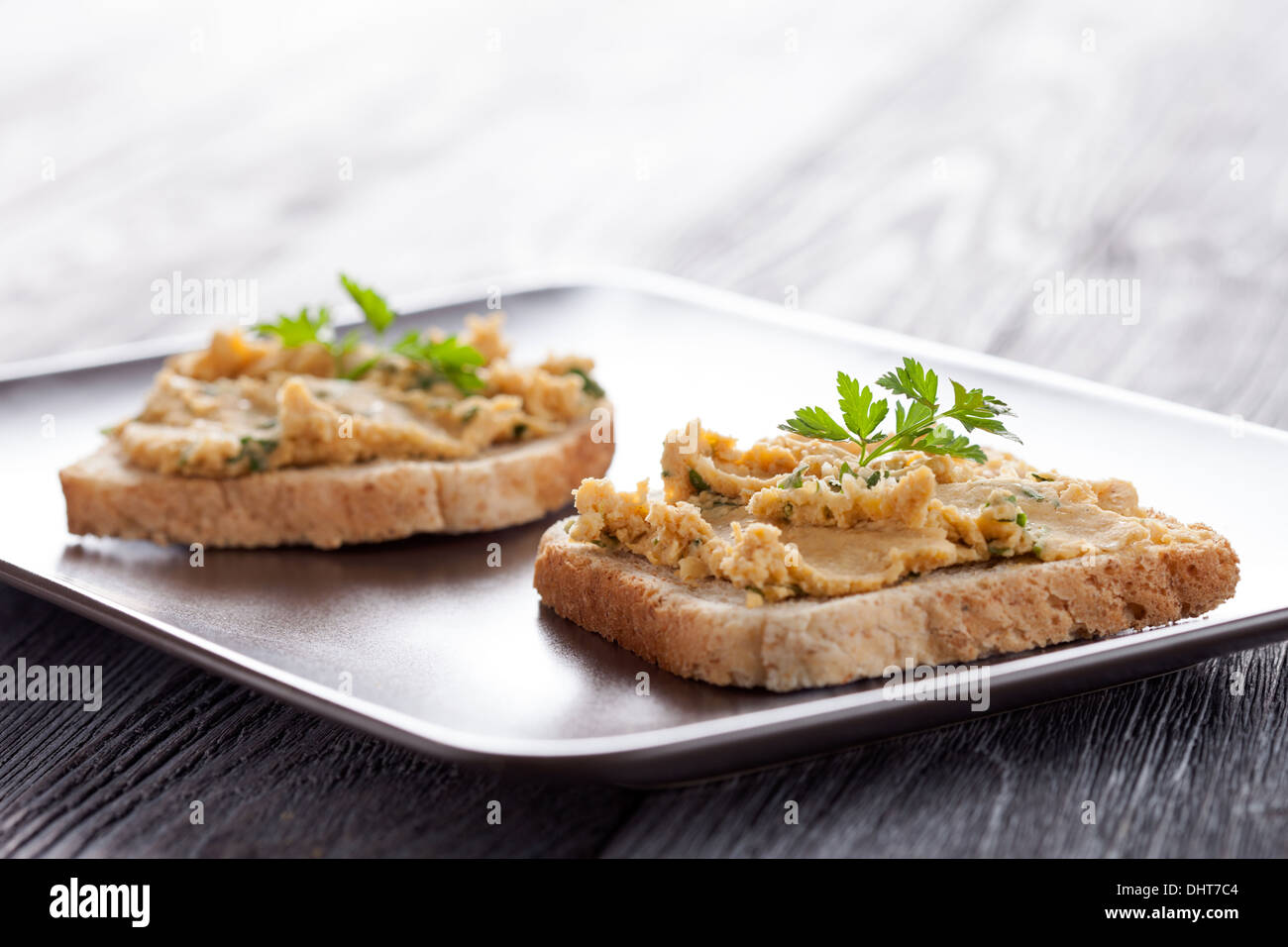 Toast with hummus Stock Photo - Alamy