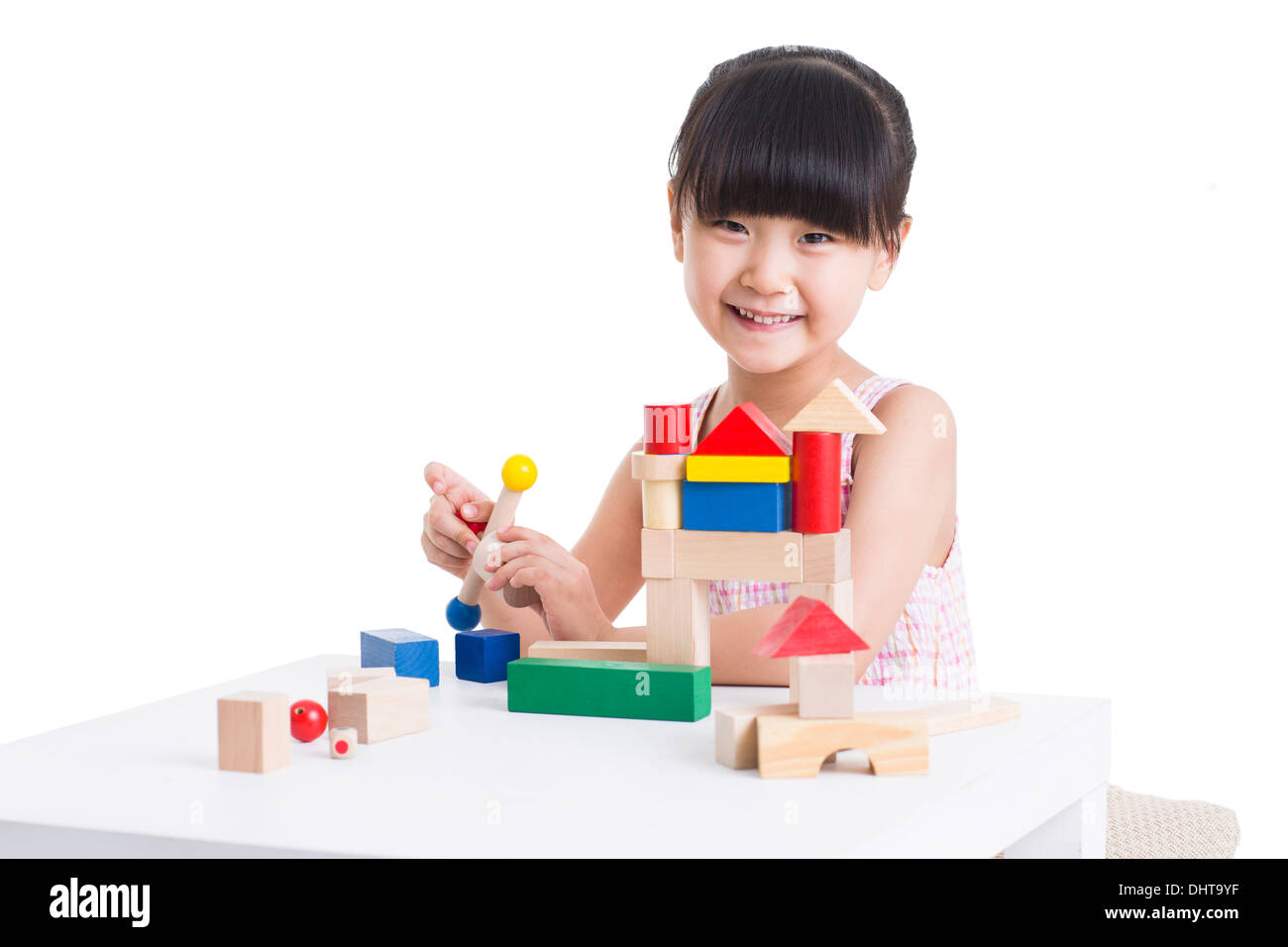 Little girl playing with building blocks Stock Photo - Alamy