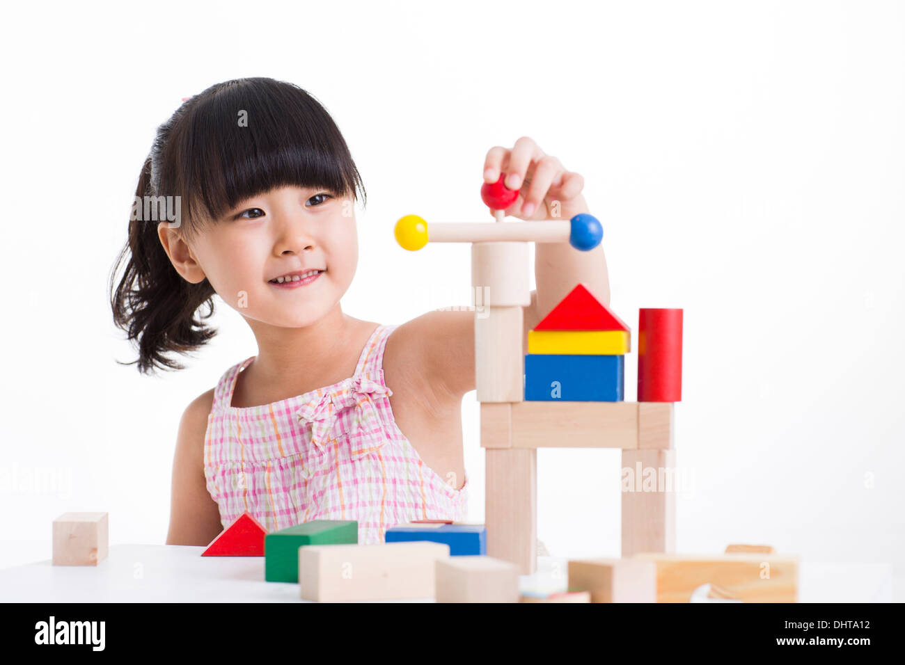 Little girl playing with building blocks Stock Photo - Alamy
