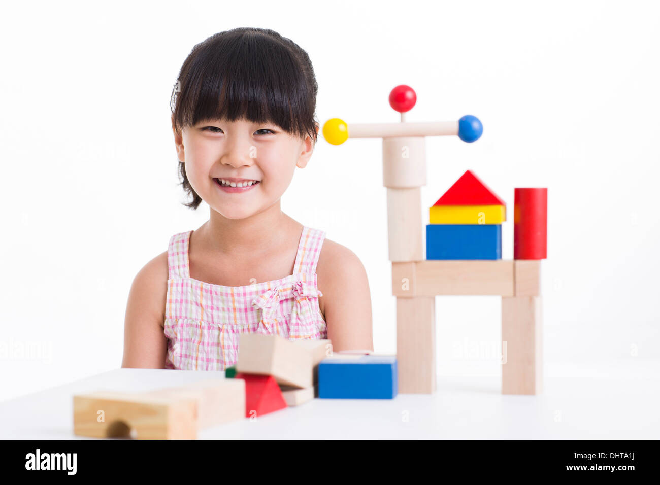Little girl playing with building blocks Stock Photo - Alamy