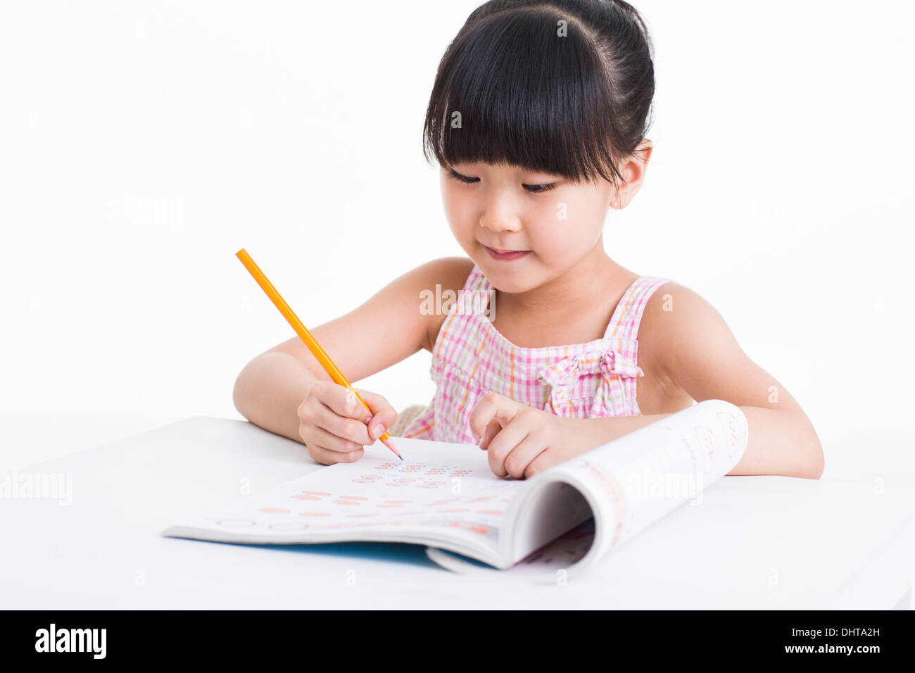 Girl ponytail writing desk hi-res stock photography and images - Alamy
