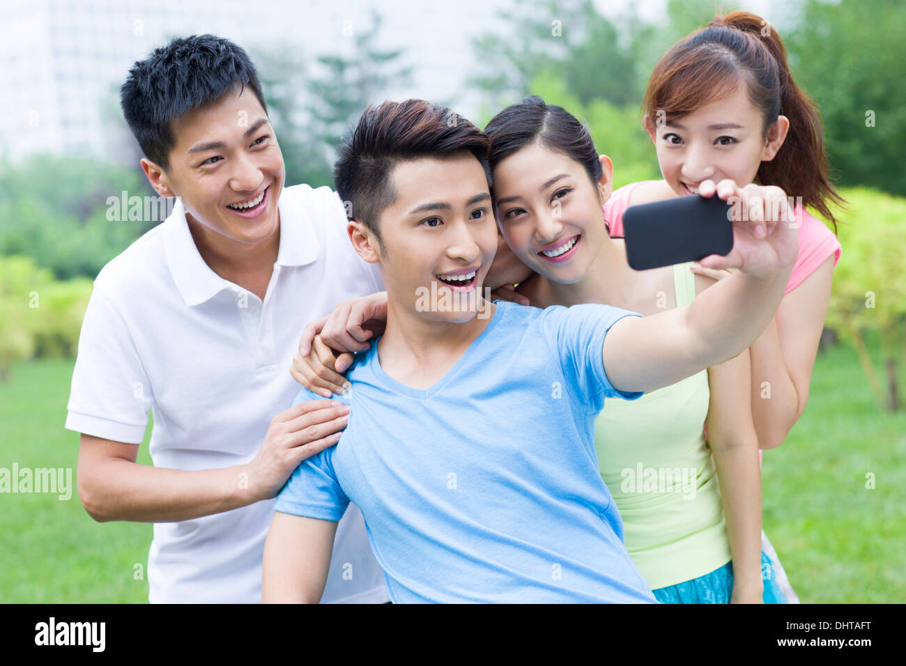 Cheerful young friends taking self portrait shot with smart phone Stock ...