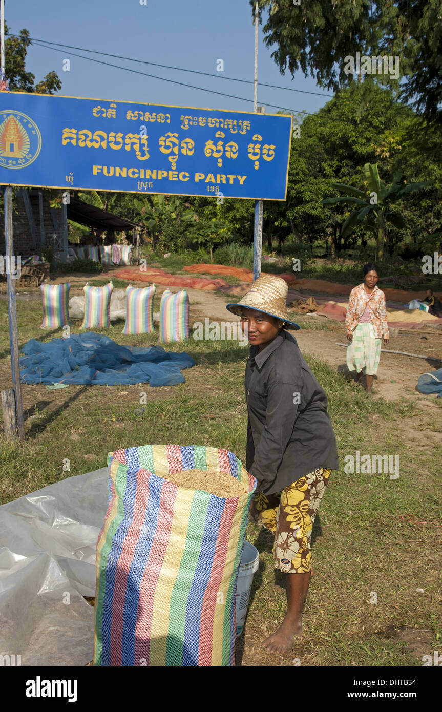 Farmer with a bulging rice bag, Cambodia Stock Photo - Alamy