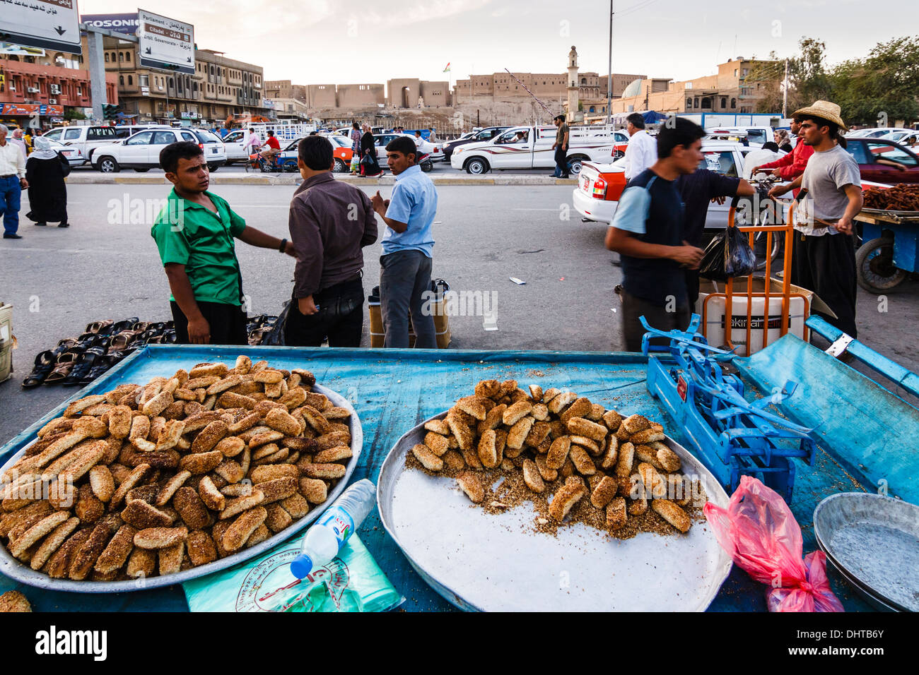 Pastries sold in a street market with citadel in background. Erbil ...