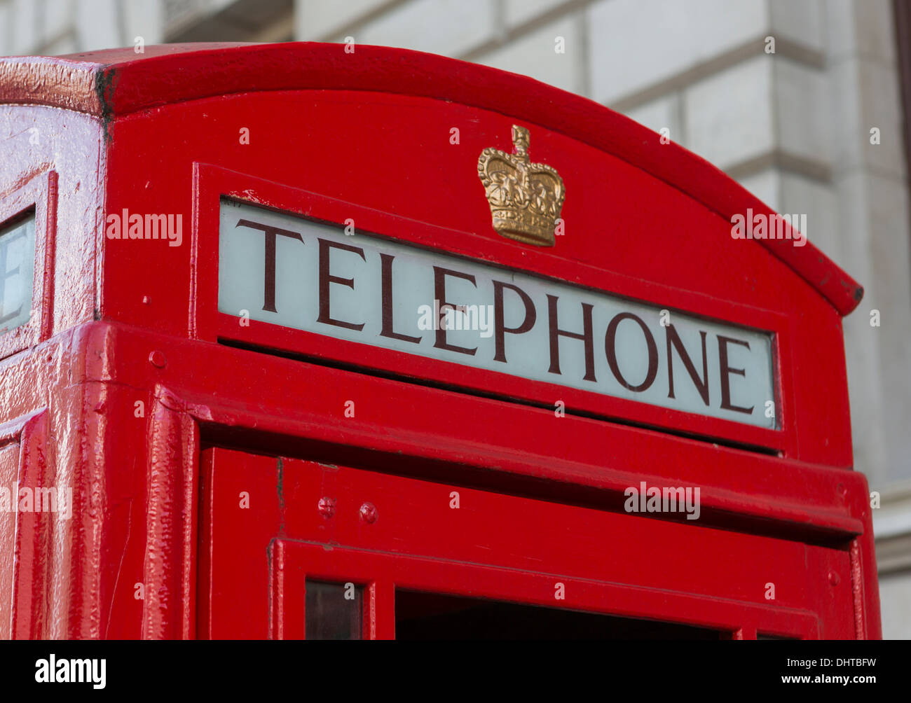 Sign on a classic red telephone booth in London, England Stock Photo ...
