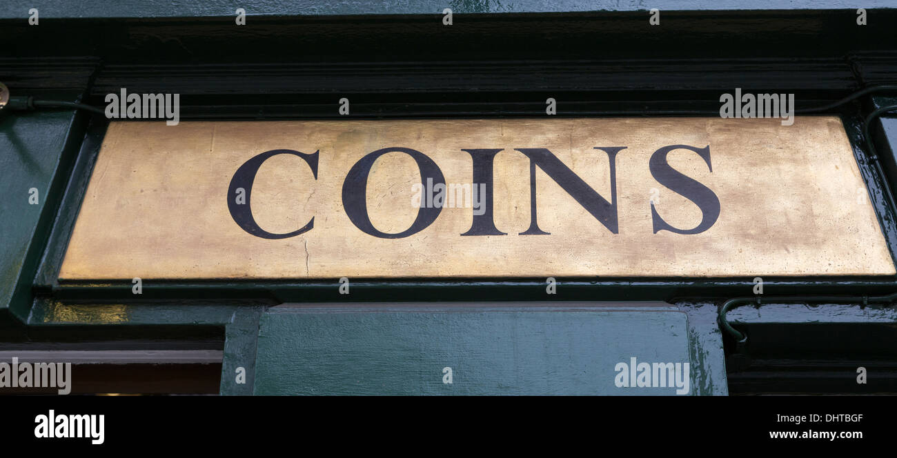 Old Fashioned "Coins" sign on a shop along Portobello Road in London ...