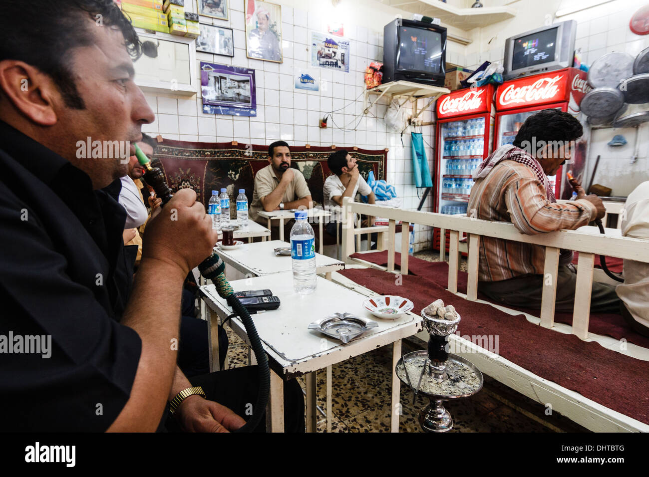 Kurdish men smoking hookah at a coffee shop in Erbil, Northern Iraq ...
