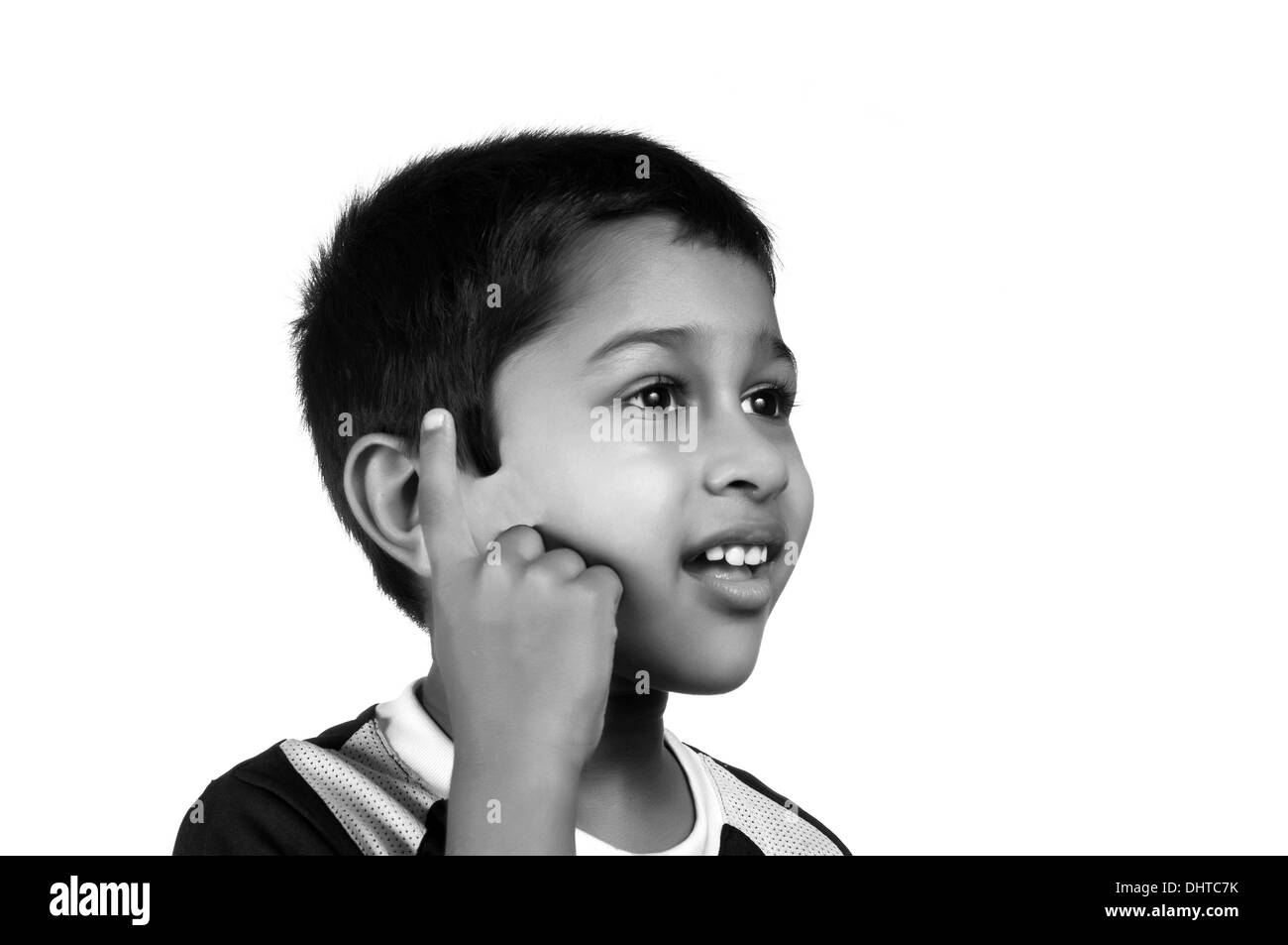 an handsome young indian kid thinking about something Stock Photo - Alamy