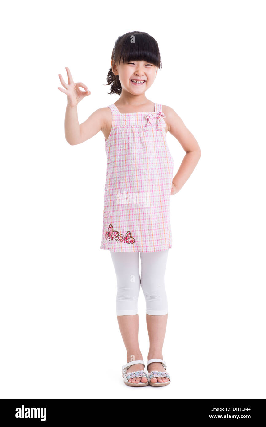 Cute little girl making OK sign Stock Photo - Alamy