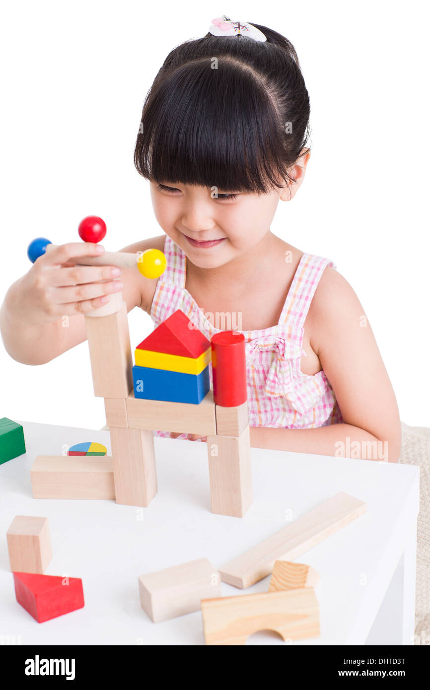 Little girl playing with building blocks Stock Photo - Alamy