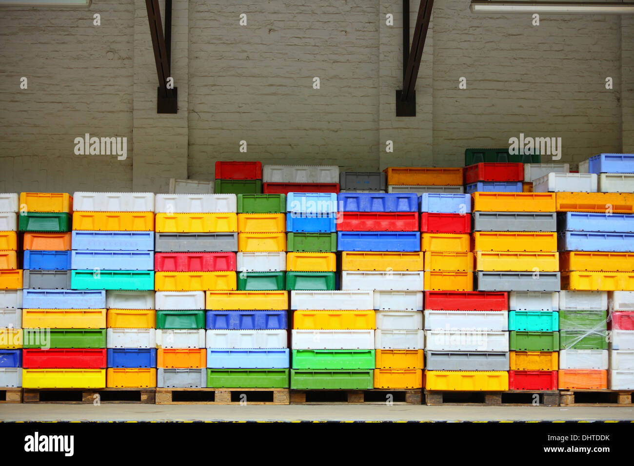 colorful boxes plastic crates. Packing containers piles for fish ...