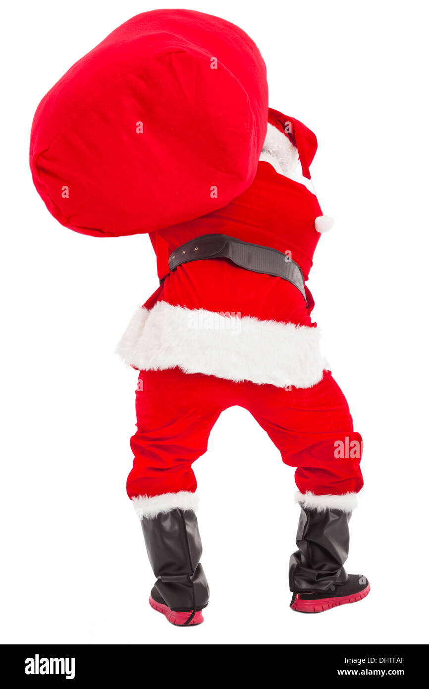 santa claus carrying heavy gift bag Stock Photo - Alamy