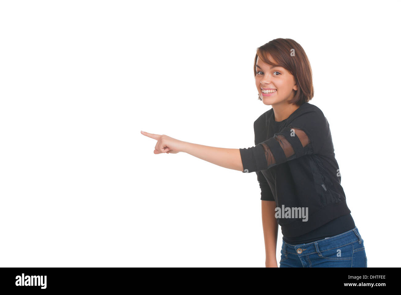 Girl pointing at something and smiling Stock Photo - Alamy