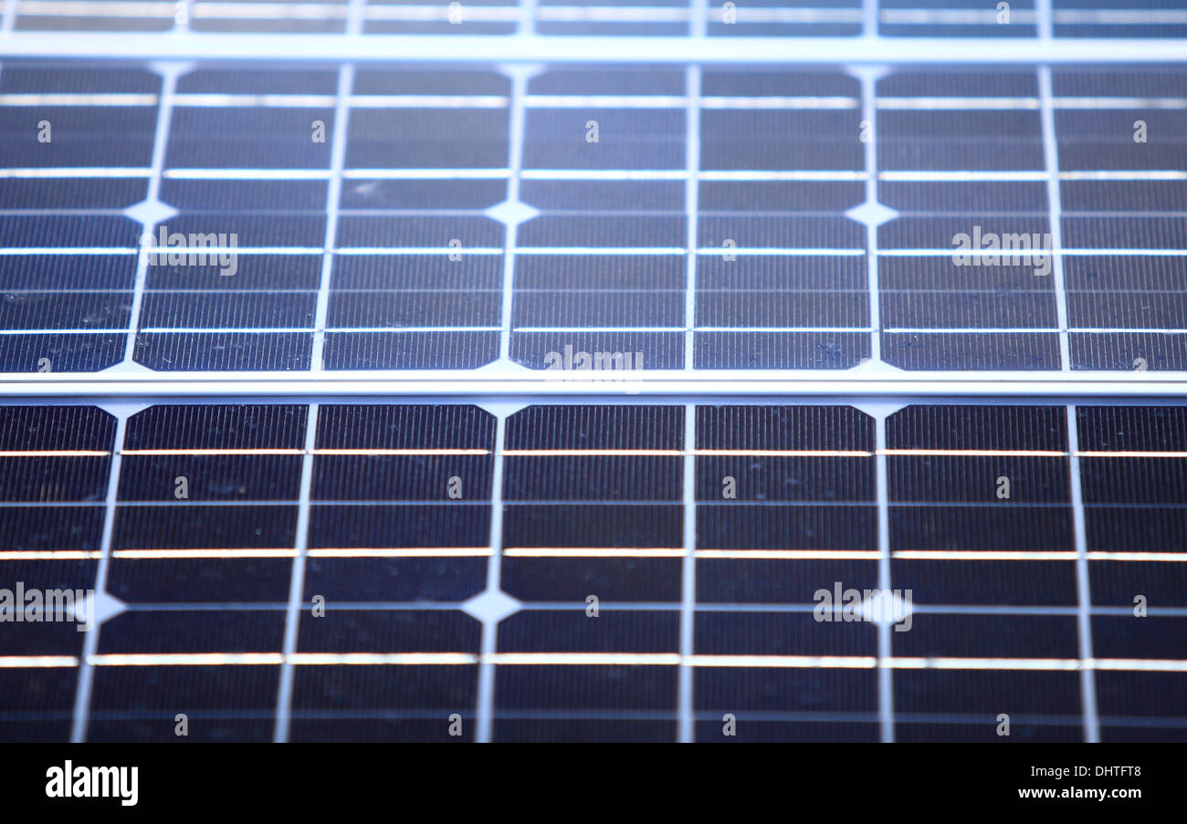 background of blue solar photovoltaic panels, charging batteries ...