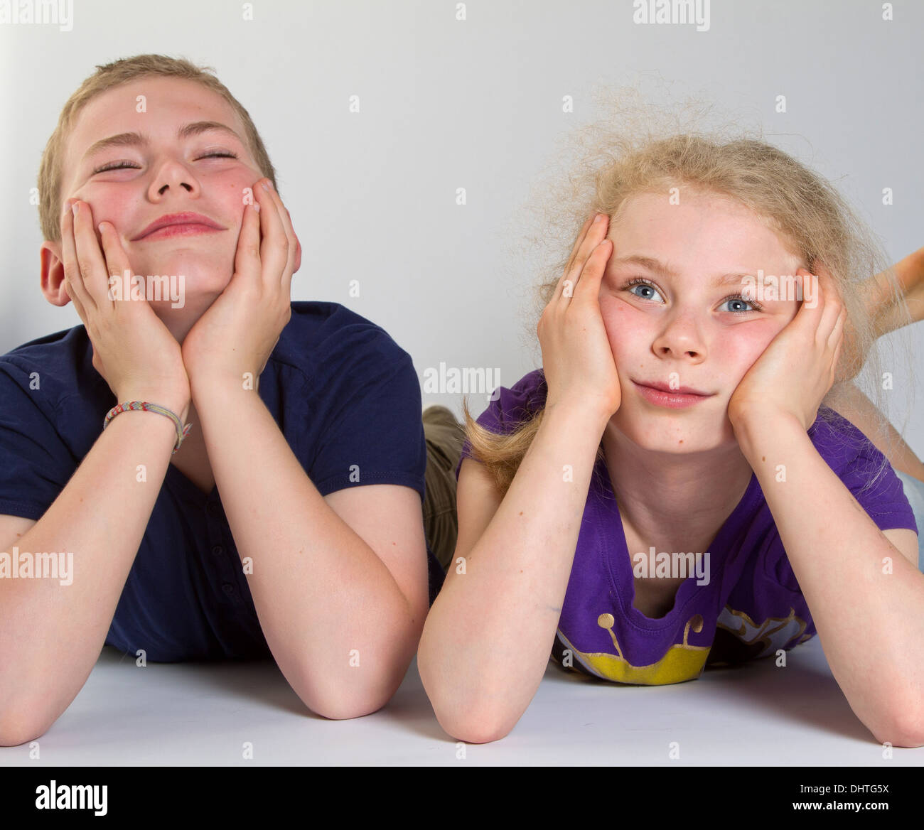 Bored kids with white background; shot in studio Stock Photo - Alamy