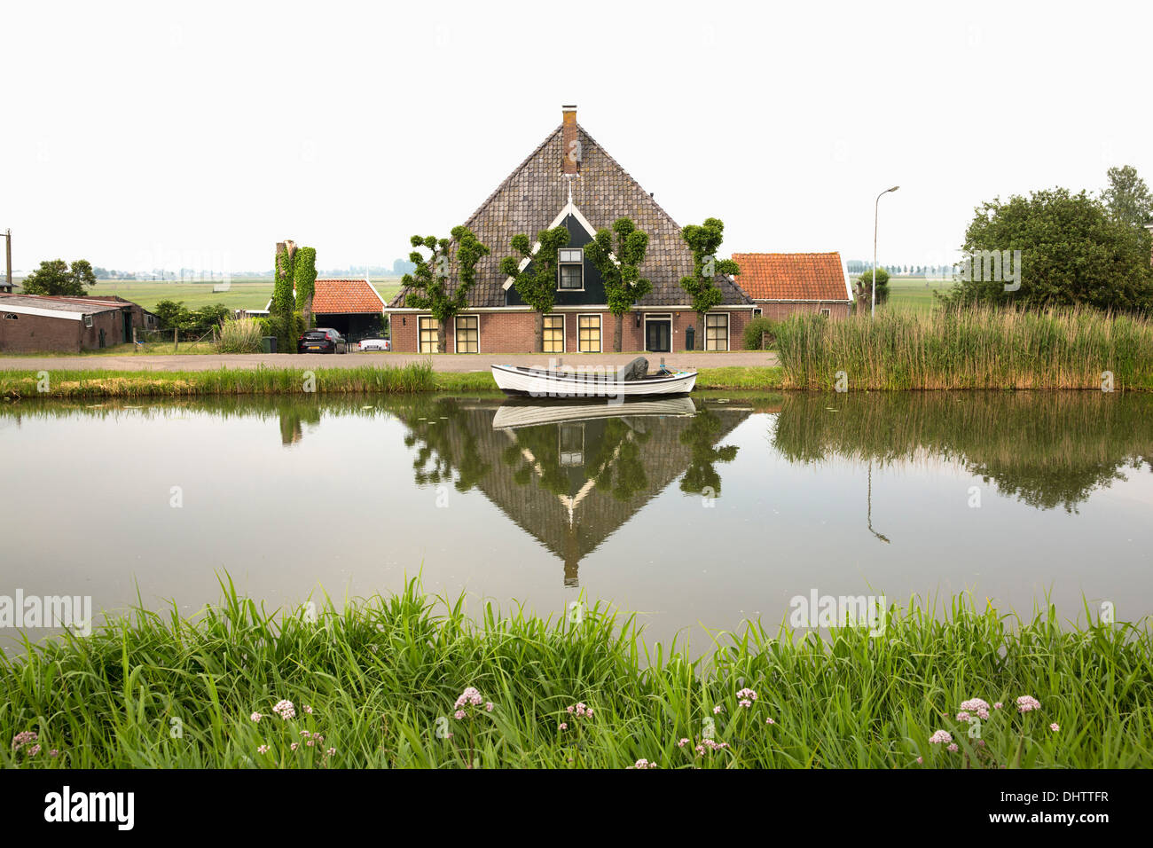 Netherlands, Noordbeemster, Typical farm at belt canal surrounding Beemster polder, a UNESCO ...