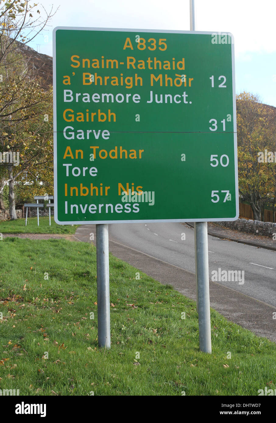 Bilingual Mileage sign Ullapool Scotland November 2013 Stock Photo - Alamy