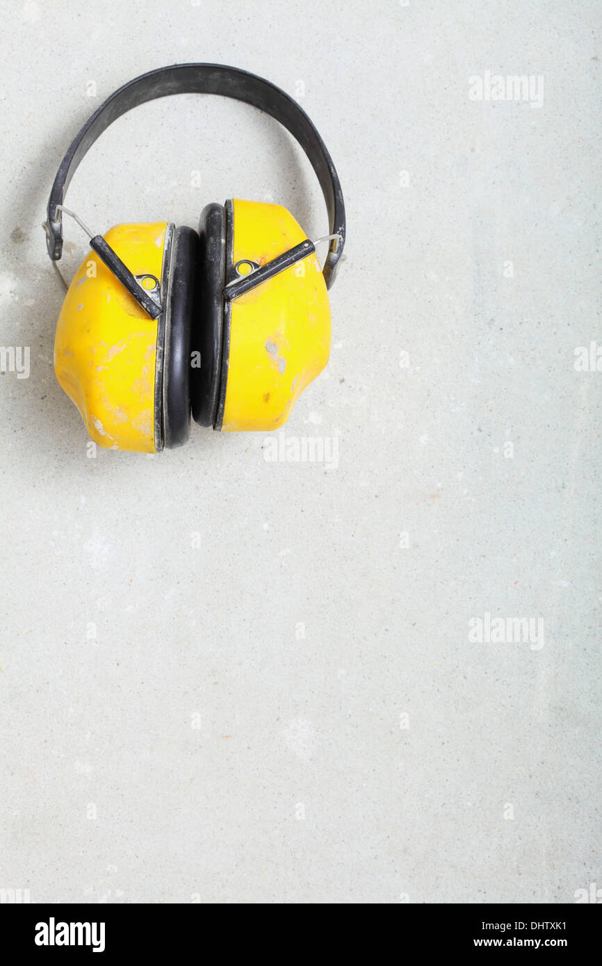Ear hearing protection. Yellow working protective headphones noise ...